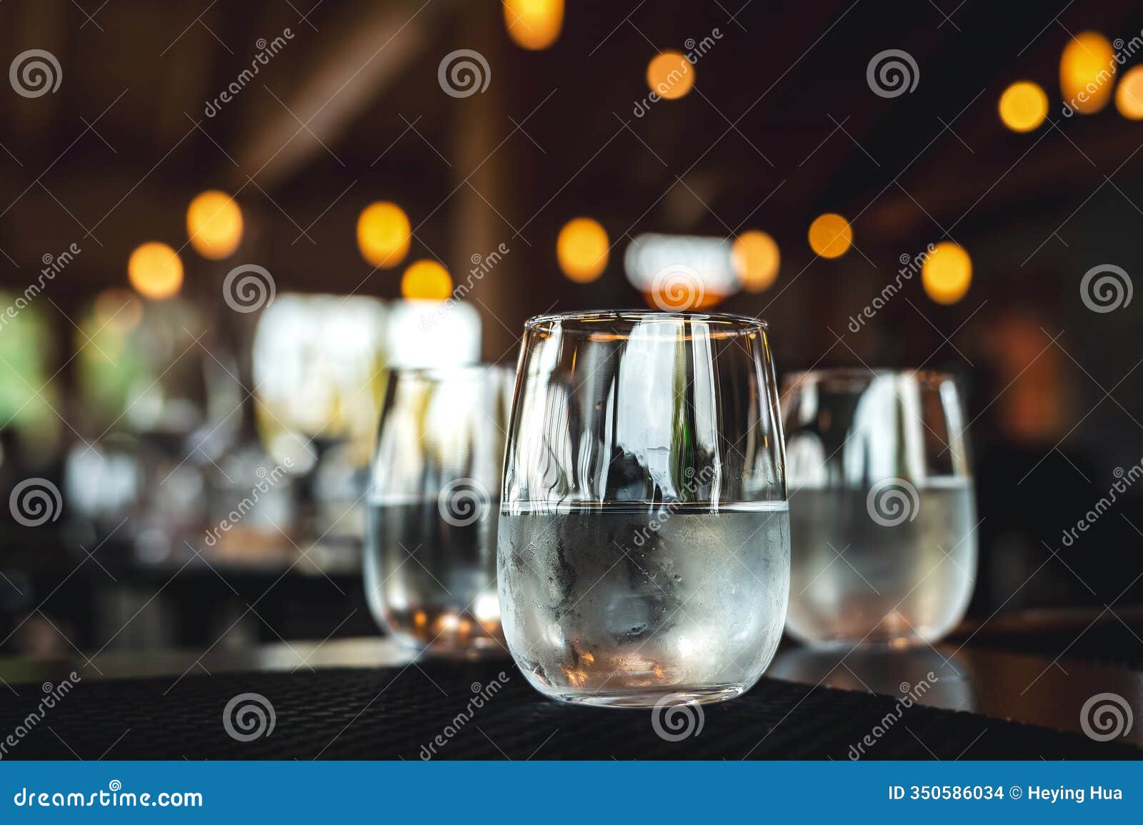 Glasses of Cold Water on a Table with a Blurred Background. Stock Photo ...