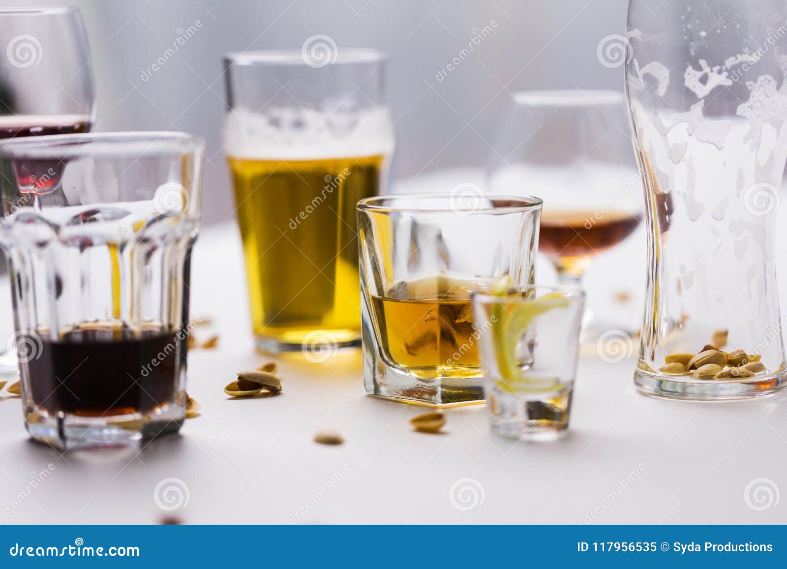 Glasses of Different Alcohol Drinks on Messy Table Stock Image - Image ...