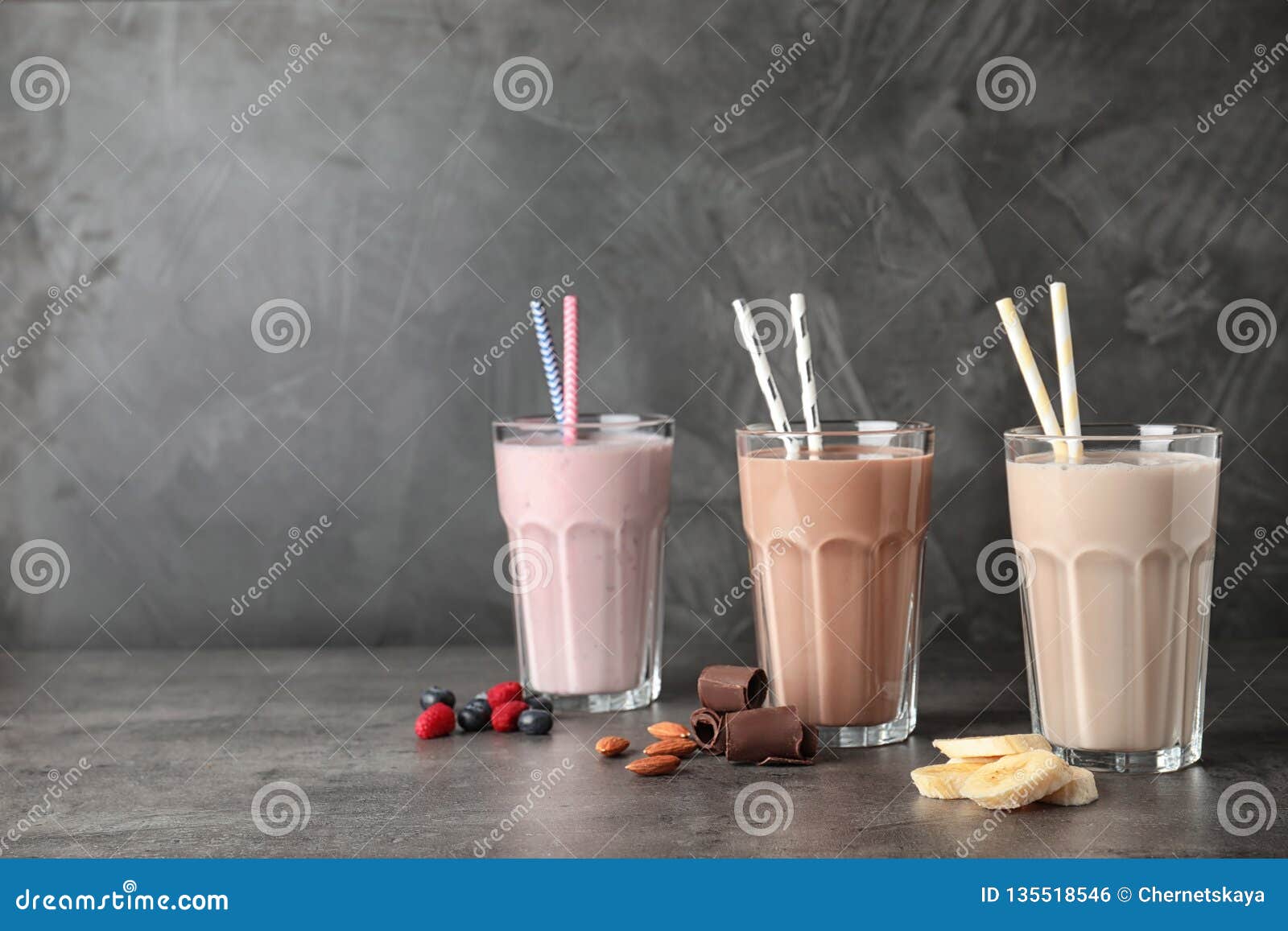 Glasses with Different Protein Shakes and Ingredients on Table Against ...