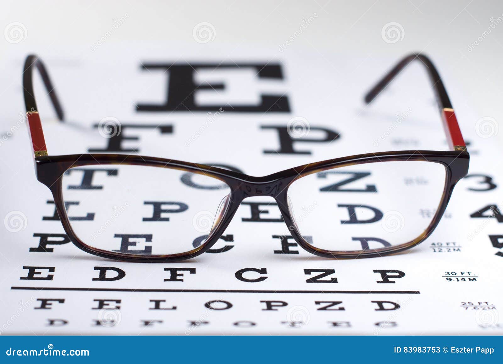 Glasses on eye chart stock image. Image of science, exam - 83983753