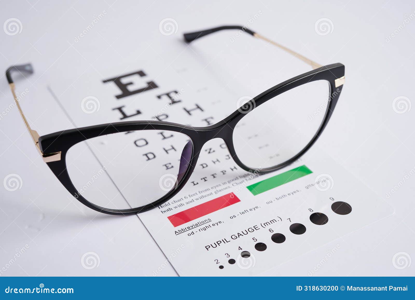 Glasses on Eye Exam Chart To Test Eyesight Accuracy of Reading Stock ...