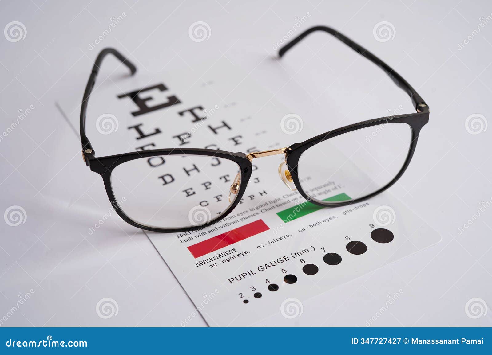 Glasses on Eye Exam Chart To Test Eyesight Accuracy of Reading Stock ...