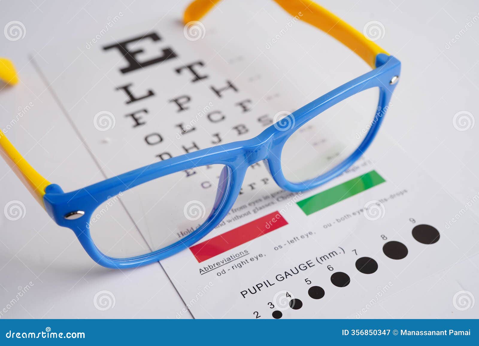 Glasses on Eye Exam Chart To Test Eyesight Accuracy of Reading Stock ...