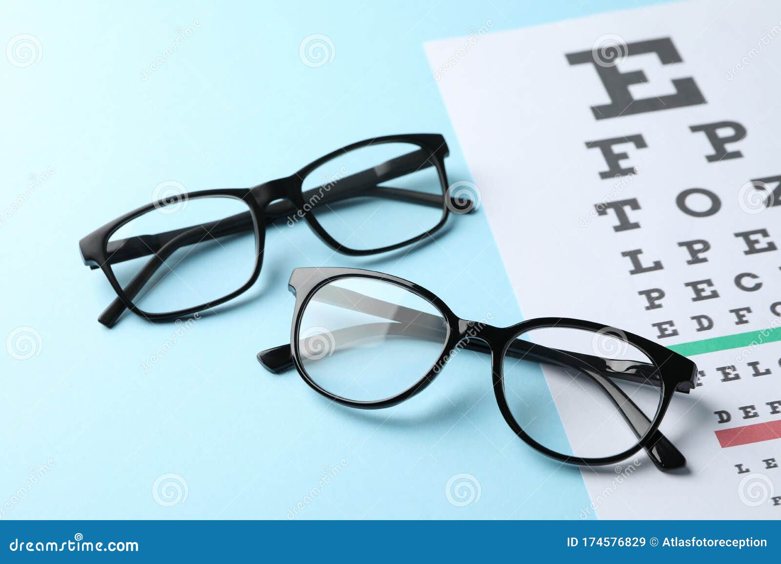 Glasses and Eye Test Chart on Blue Background Stock Image - Image of ...
