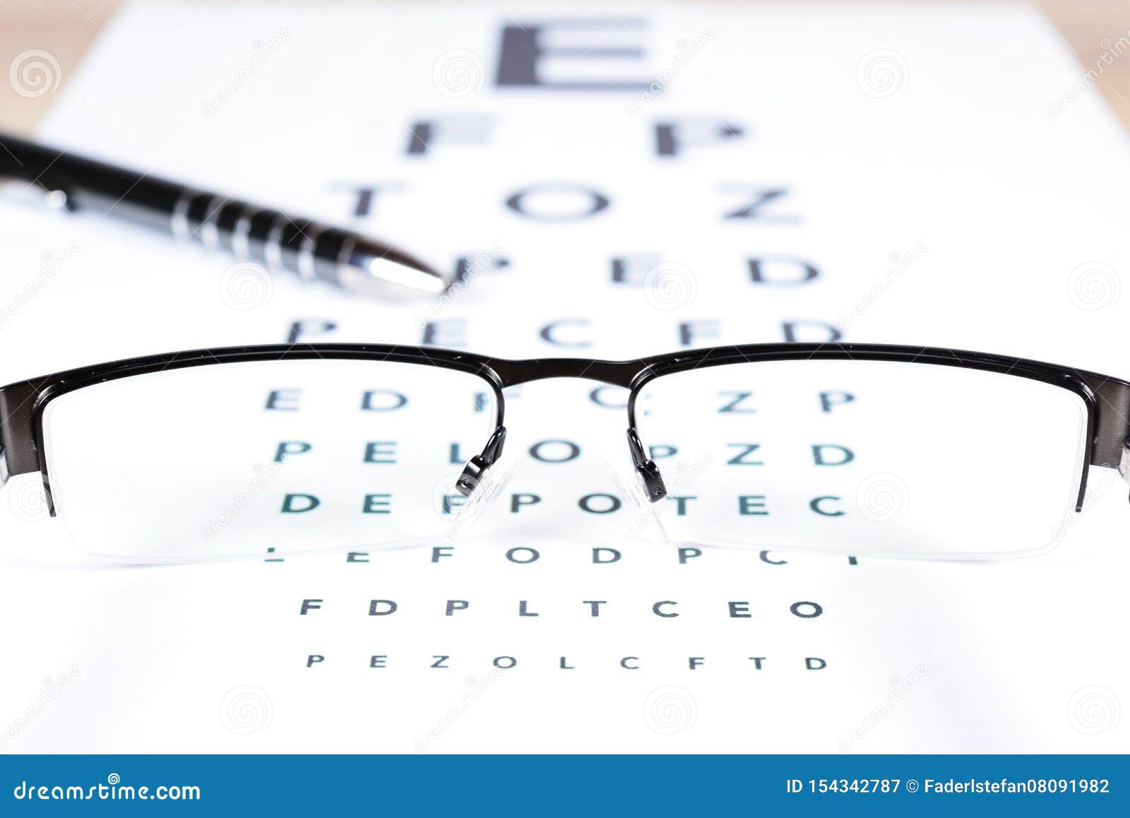 Glasses with Eye Test and Pen Stock Image - Image of diopter, clue ...