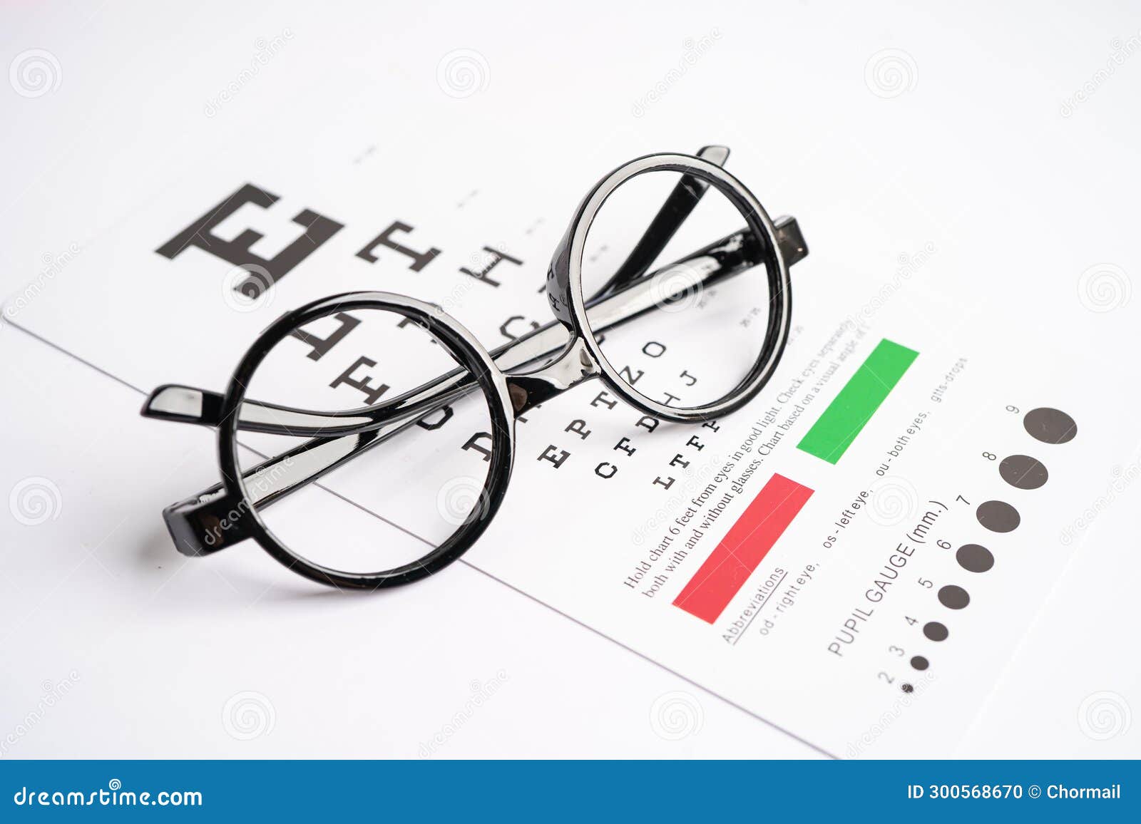 Glasses on Eye Testing Exam Chart To Check Eyesight Accuracy of Reading ...