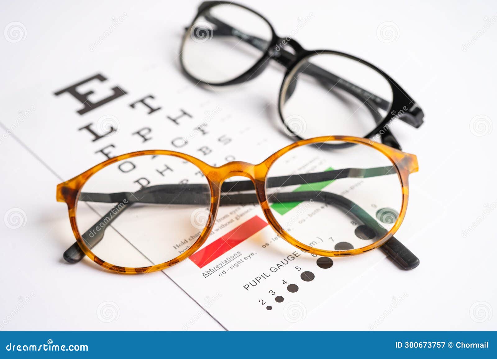Glasses on Eye Testing Exam Chart To Check Eyesight Accuracy of Reading ...
