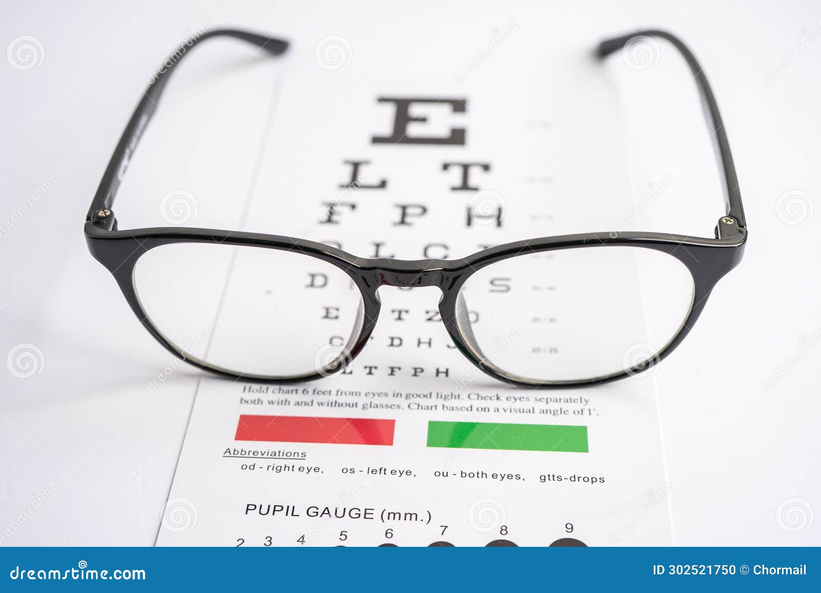Glasses on Eye Testing Exam Chart To Check Eyesight Accuracy of Reading ...