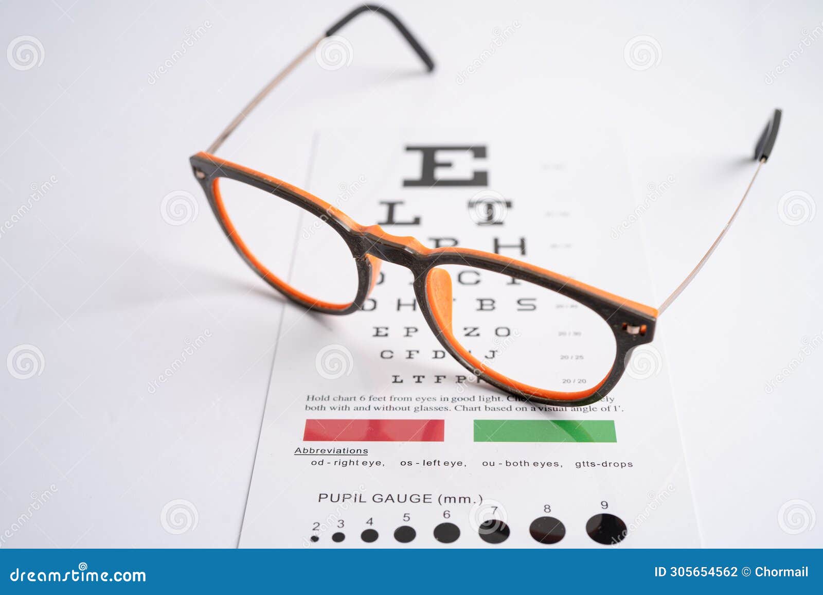 Glasses on Eye Testing Exam Chart To Check Eyesight Accuracy of Reading ...