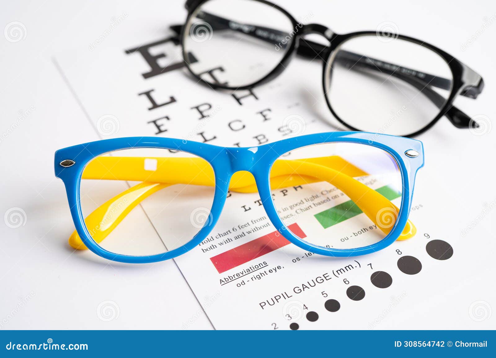 Glasses on Eye Testing Exam Chart To Check Eyesight Accuracy of Reading ...
