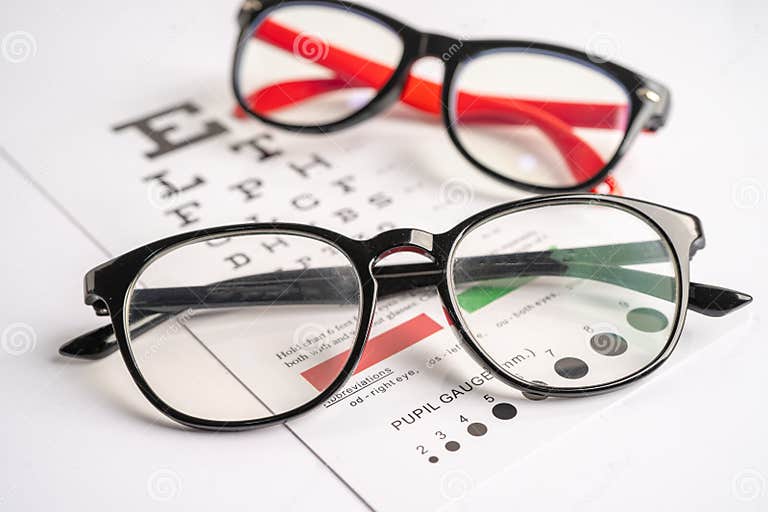 Glasses on Eye Testing Exam Chart To Check Eyesight Accuracy of Reading ...