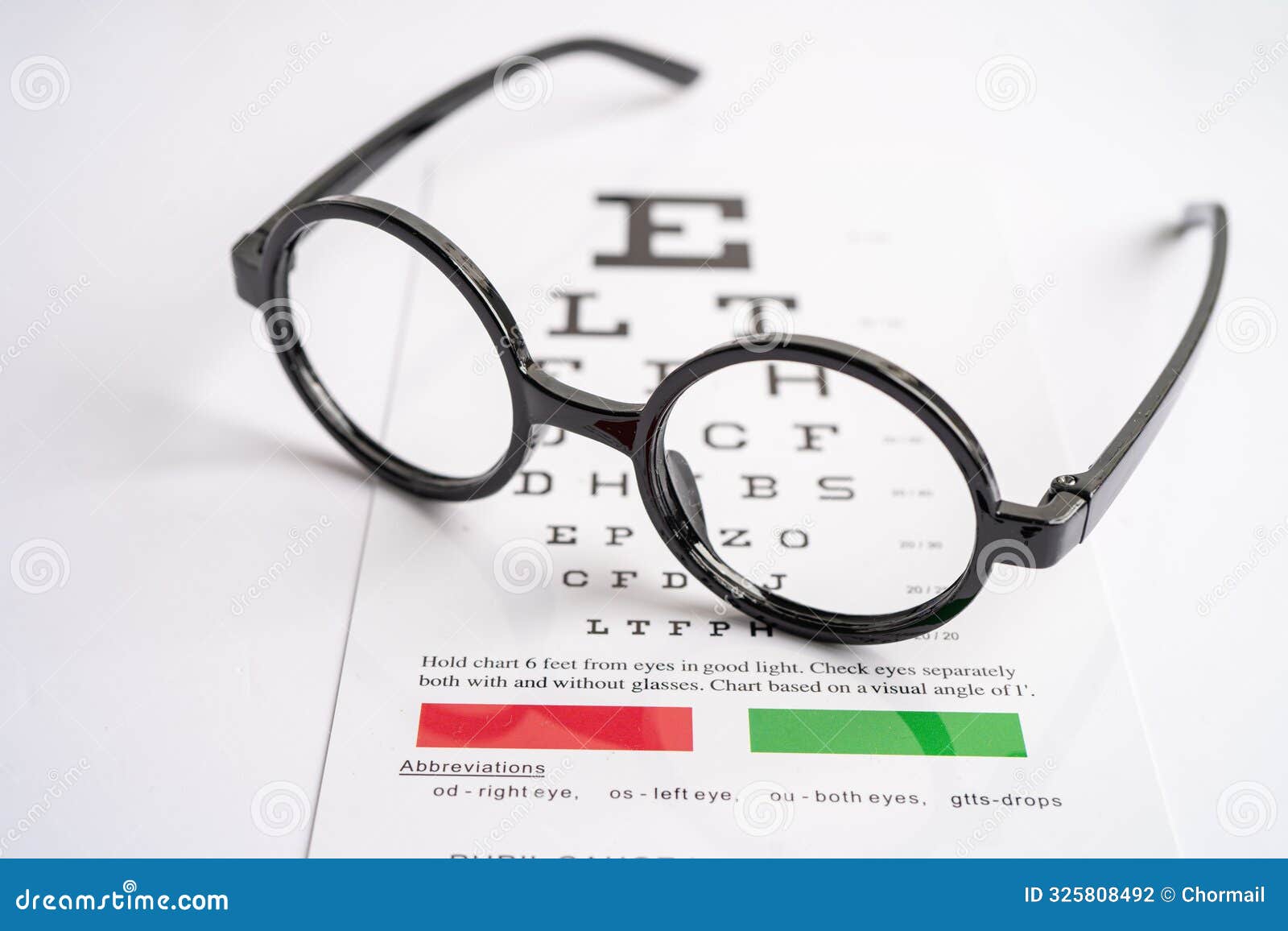 Glasses on Eye Testing Exam Chart To Check Eyesight Accuracy of Reading ...