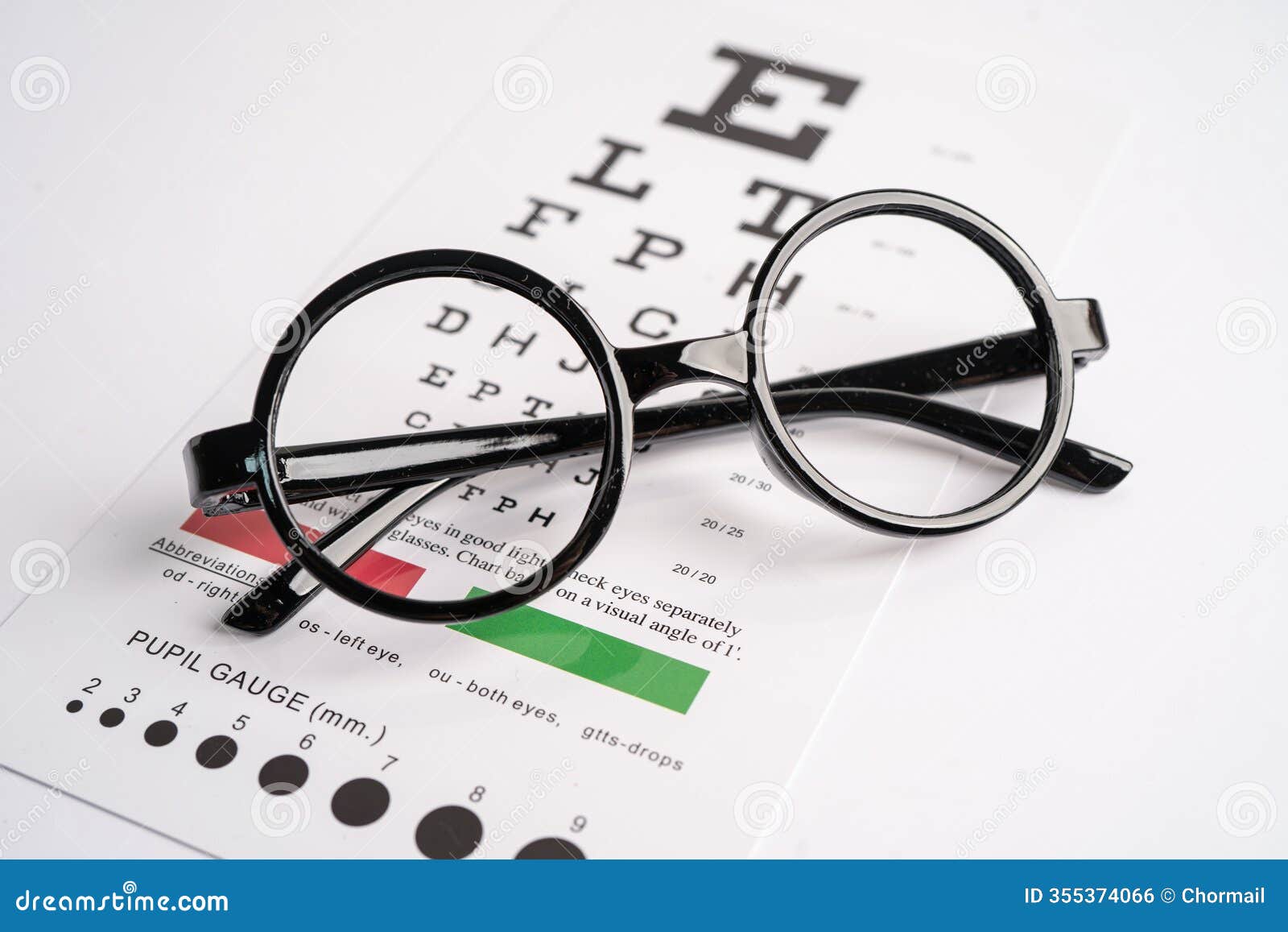Glasses on Eye Testing Exam Chart To Check Eyesight Accuracy of Reading ...