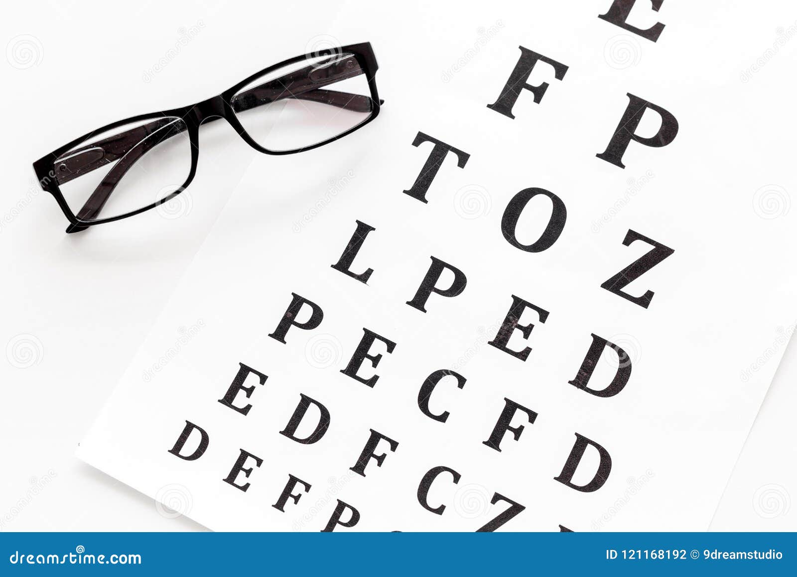 Glasses on Eyesight Test on White Background Top View Stock Photo ...