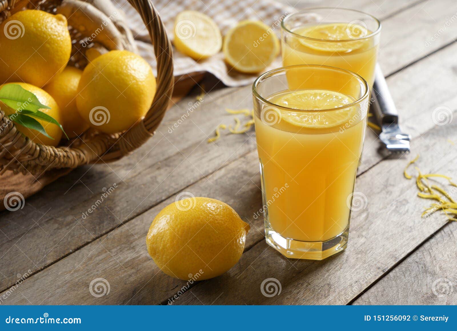 Glasses of Fresh Lemon Juice on Wooden Table Stock Photo - Image of ...