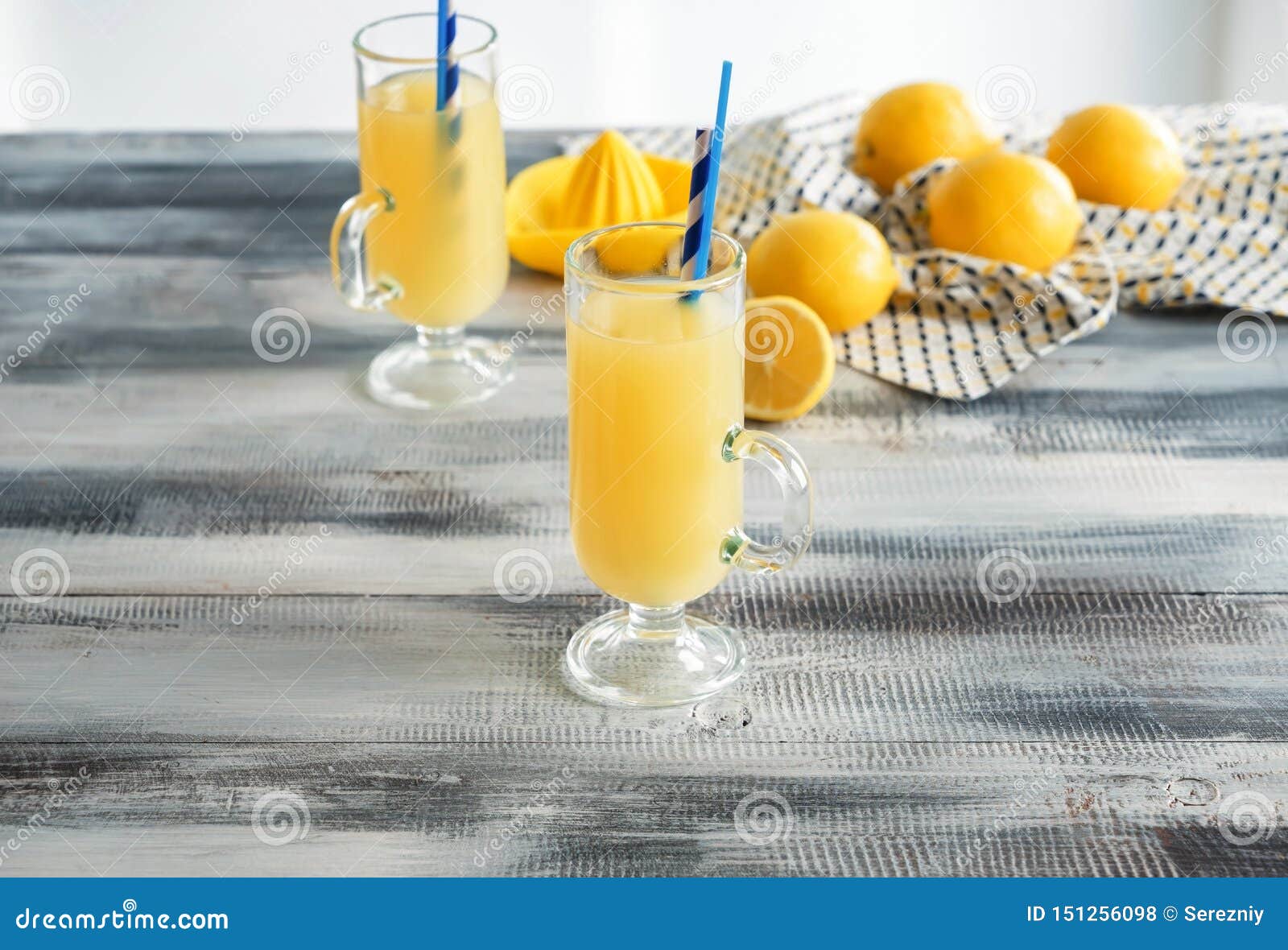 Glasses of Fresh Lemon Juice on Wooden Table Stock Photo - Image of ...