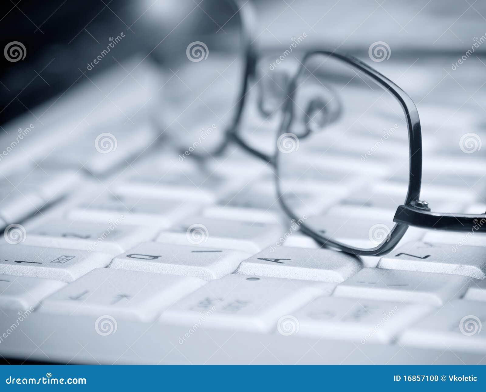Glasses on the keyboard stock photo. Image of communication - 16857100