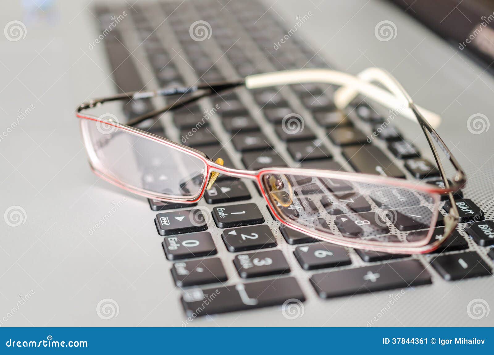 Glasses on Laptop Keyboard stock image. Image of keyboard - 37844361
