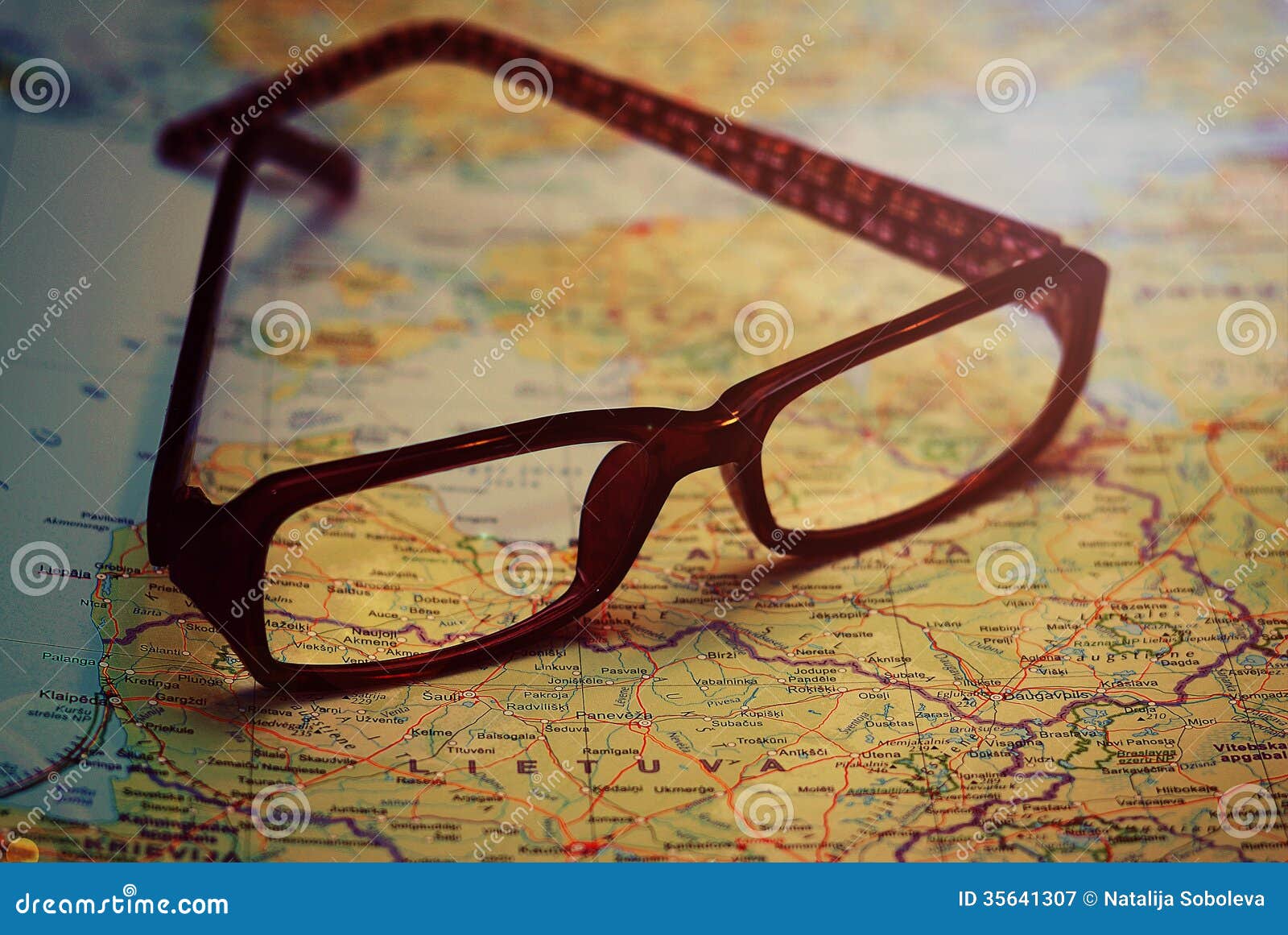Glasses on map background stock image. Image of search - 35641307