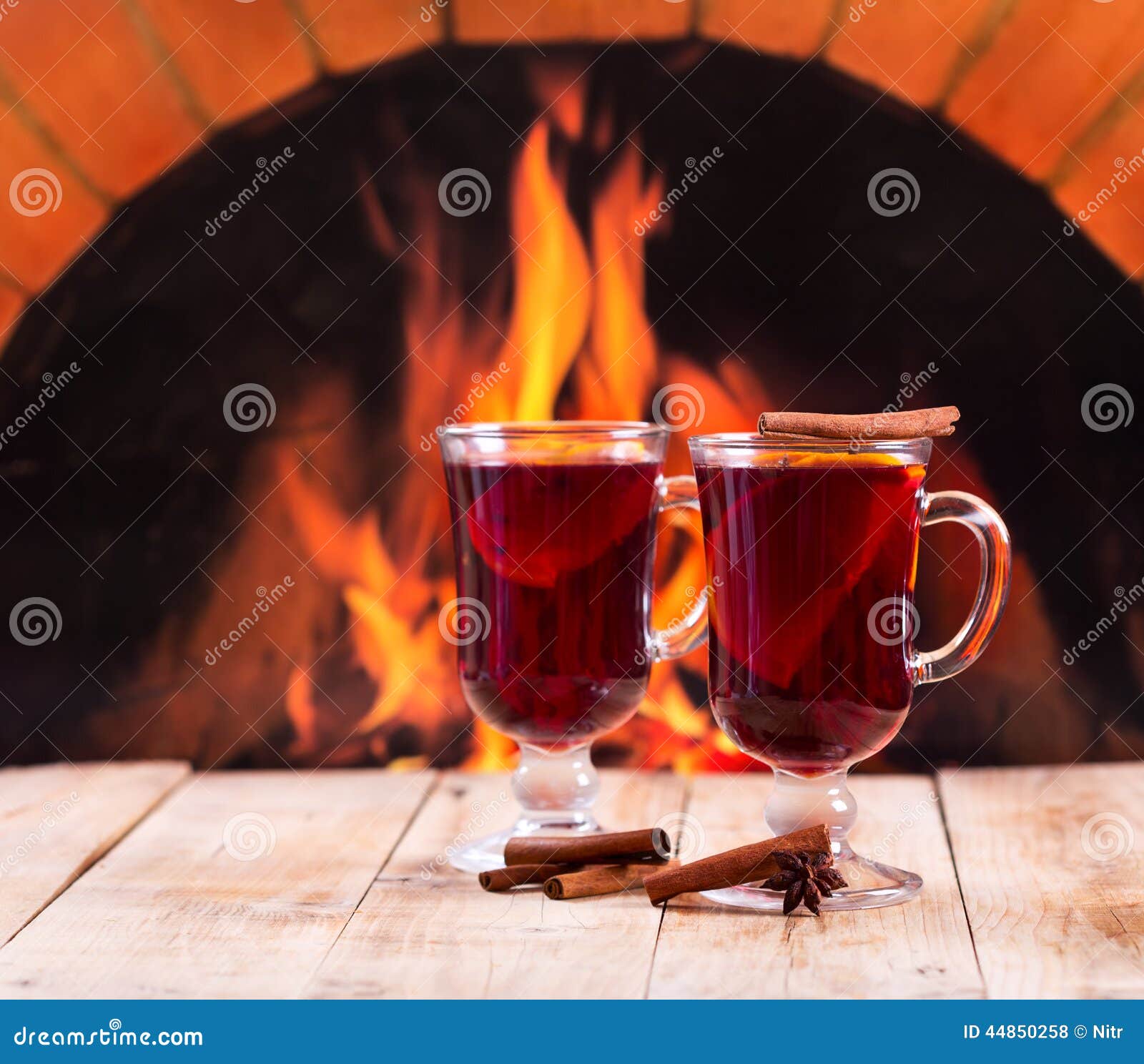 Glasses of Mulled Wine Over Fireplace Stock Photo - Image of clove ...