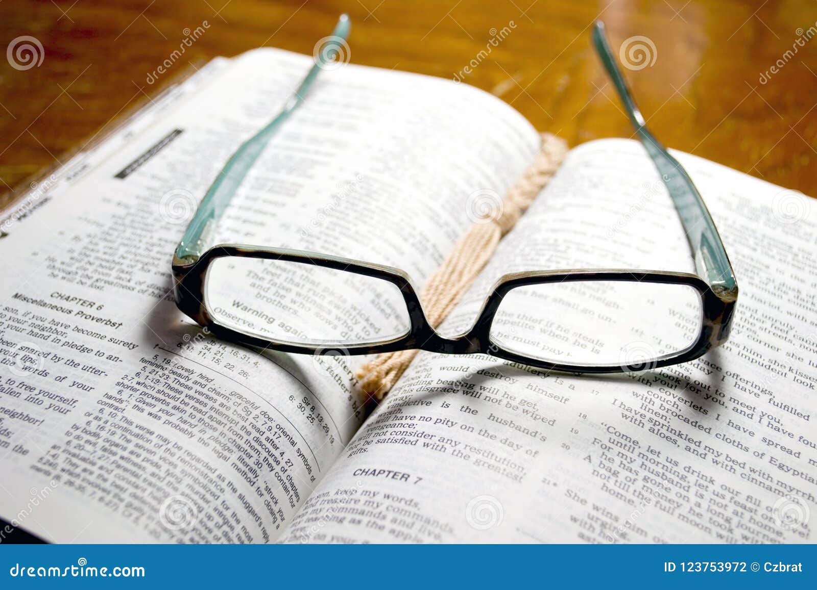 Glasses on Open Bible stock photo. Image of resting - 123753972