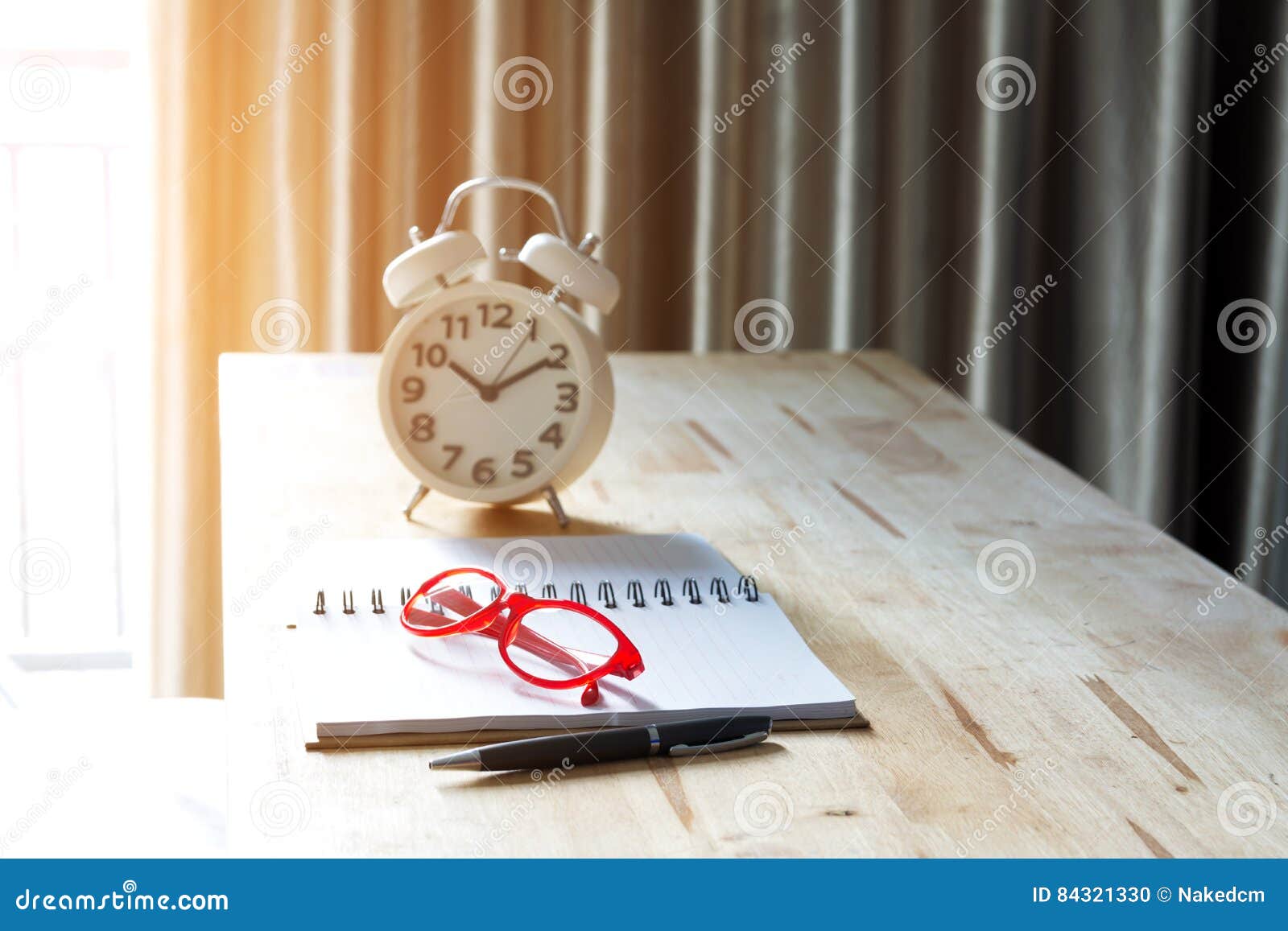 Glasses on Open Notebook with Alarm Clock on Wood Desk Stock Photo ...