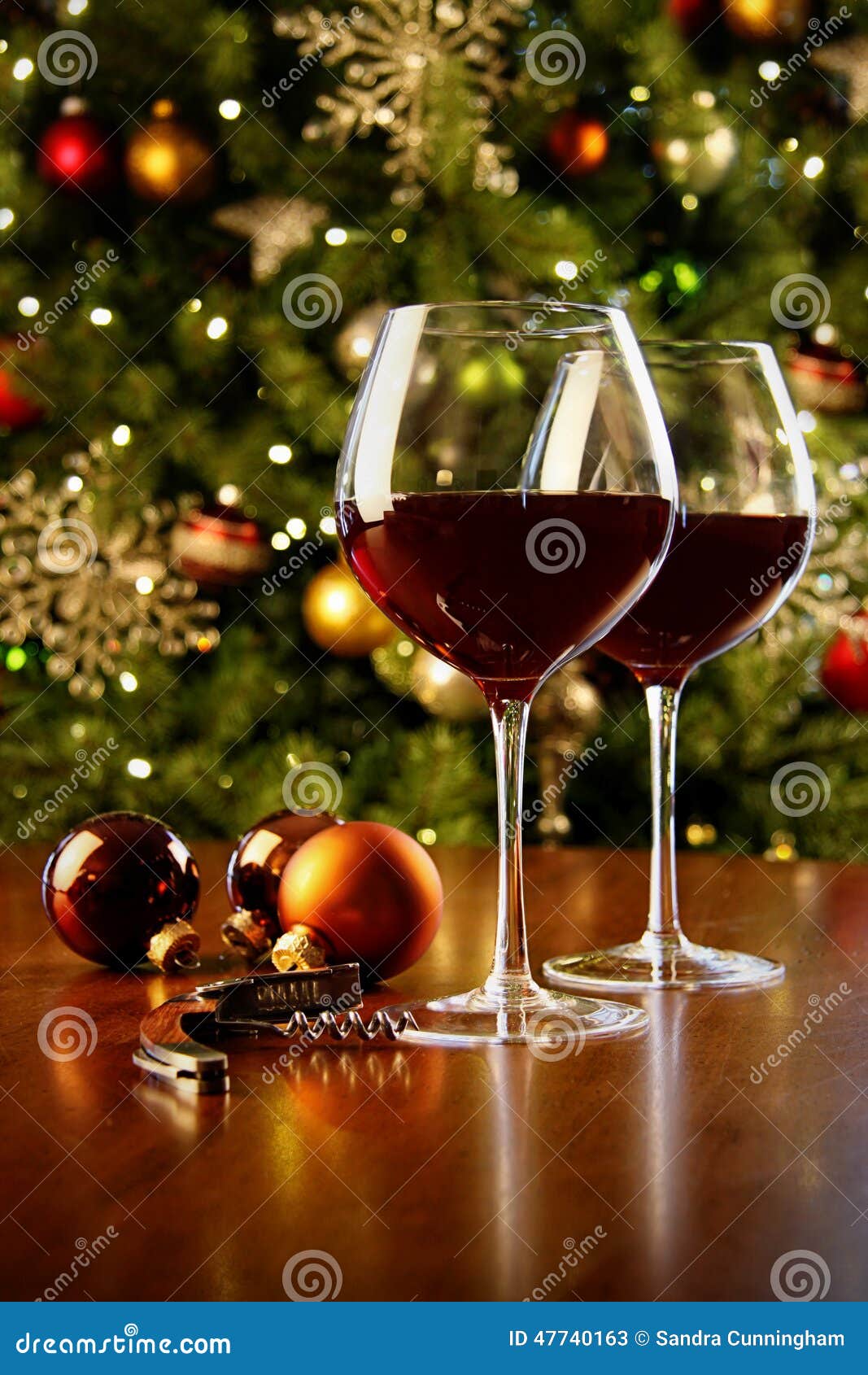 Glasses of Red Wine on Table with Christmas Tree Stock Image - Image of ...