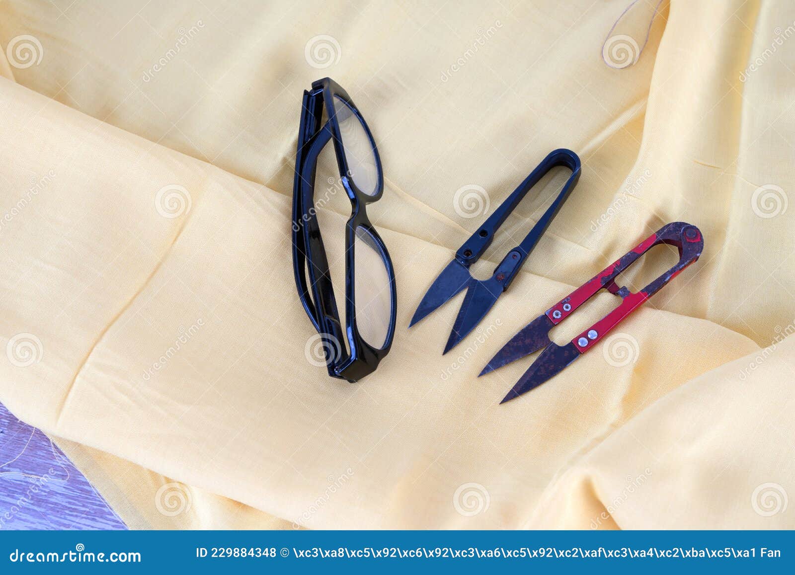 Glasses and Scissors on Yellow Cloth Stock Photo - Image of cloth ...
