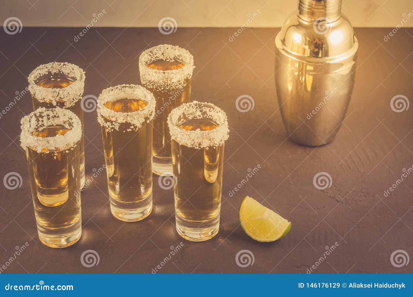 Glasses of Tequila and Pieces of Lime and Shaker/glasses of Tequila and ...