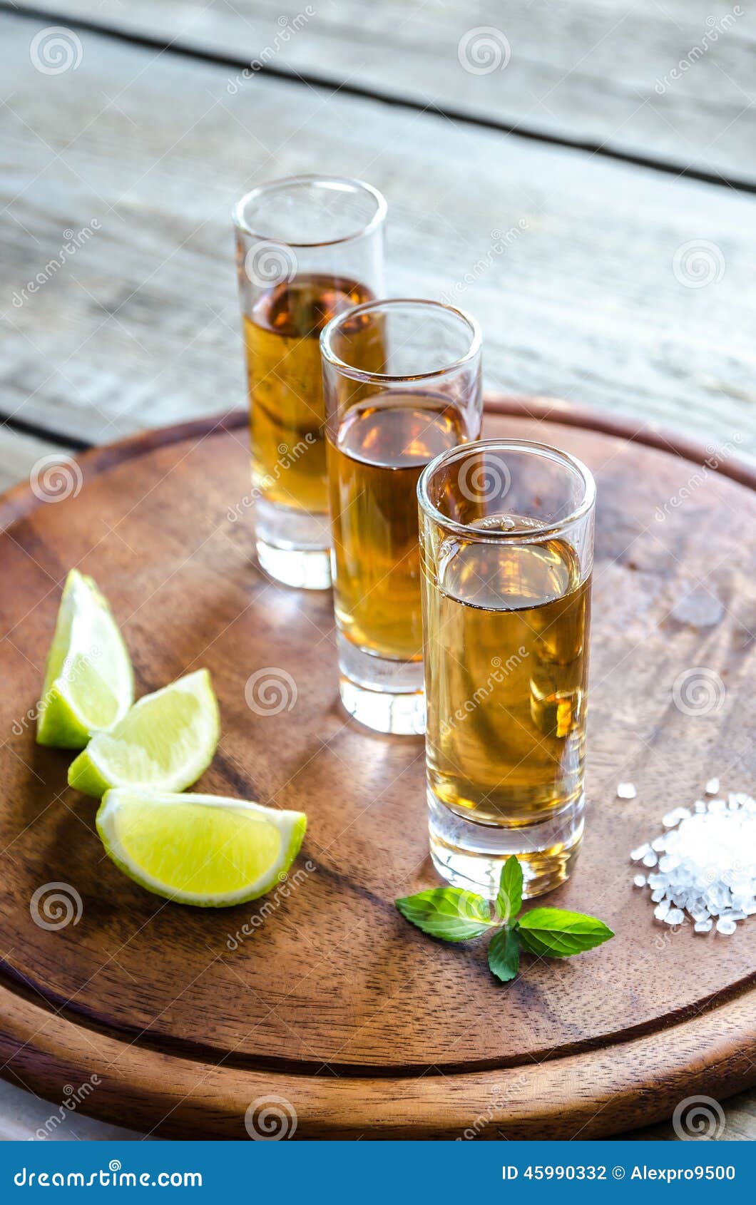 Glasses of Tequila on the Wooden Board Stock Photo - Image of narrow ...