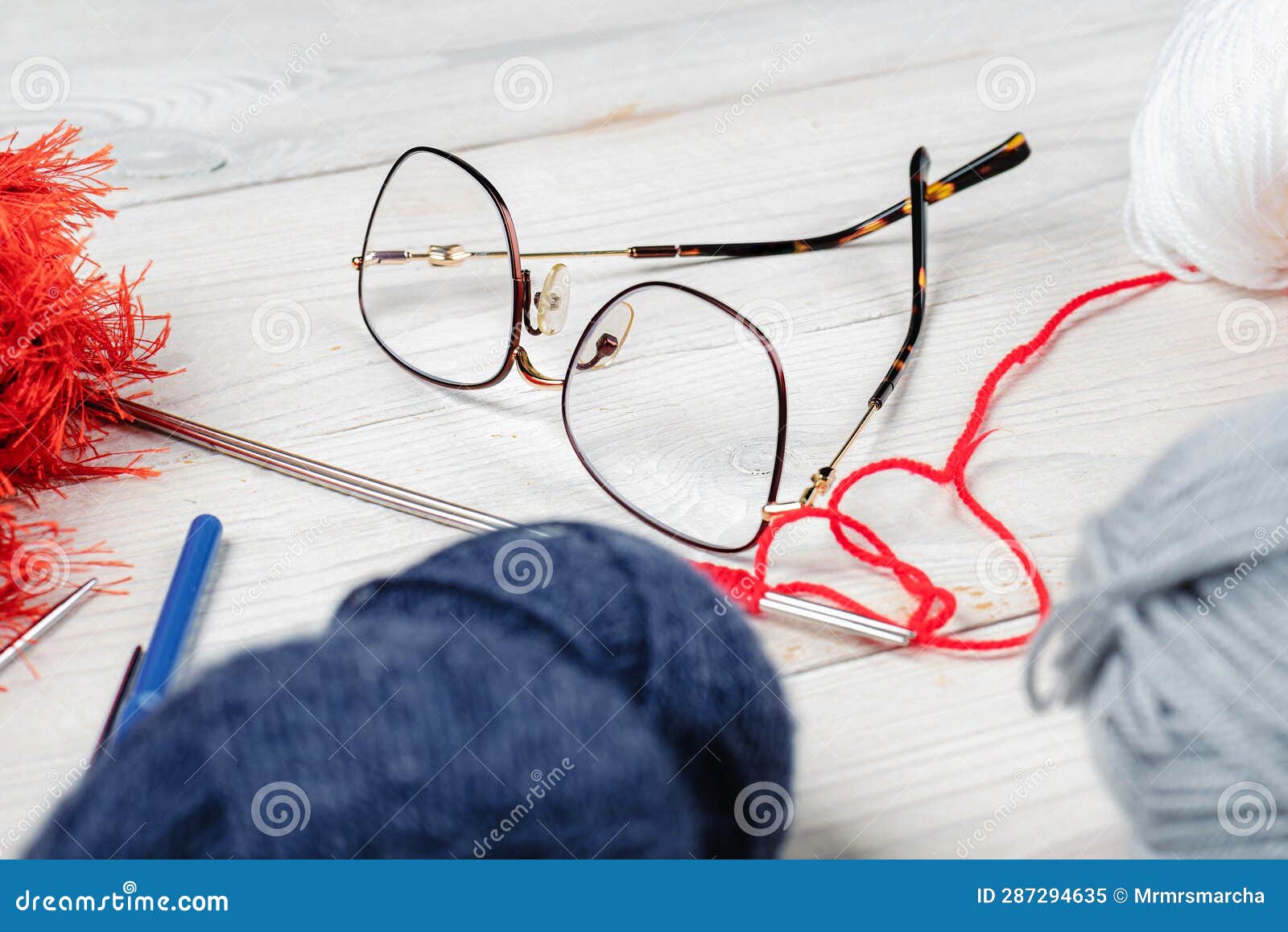 Glasses with Threads for Knitting on a White Wooden Table. Knitting ...