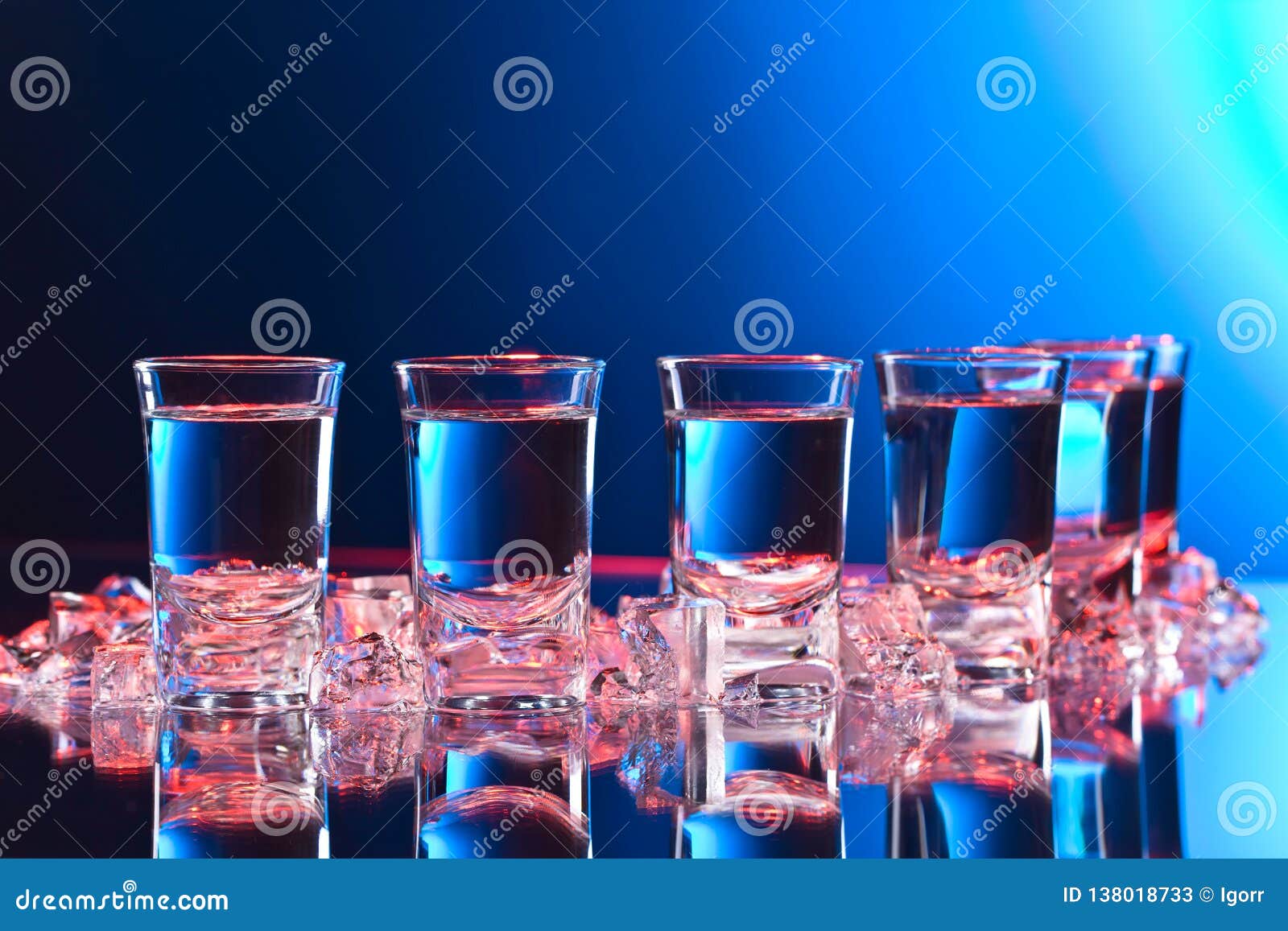 Glasses of Vodka with Ice on a Glass Table Stock Image - Image of ...