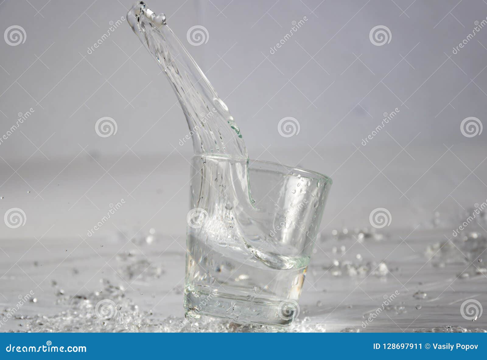 Glasses of Water Falling and Jumping with Splashes and Drops Stock ...