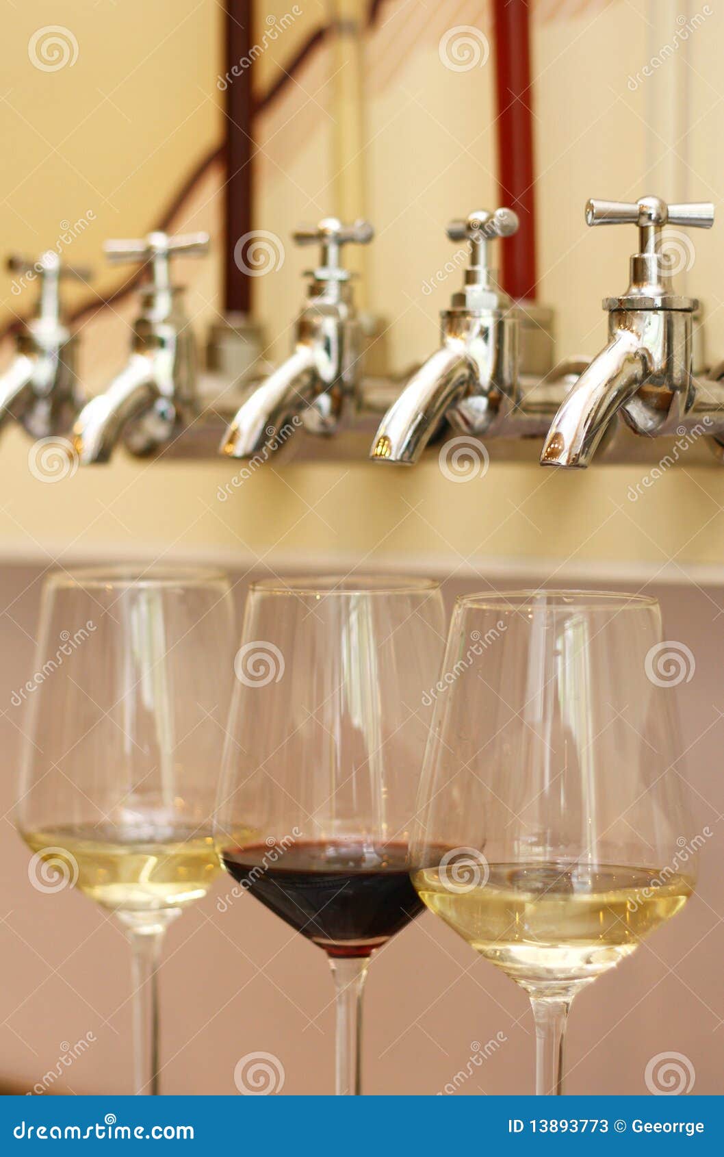 Glasses of wine under taps stock image. Image of life - 13893773
