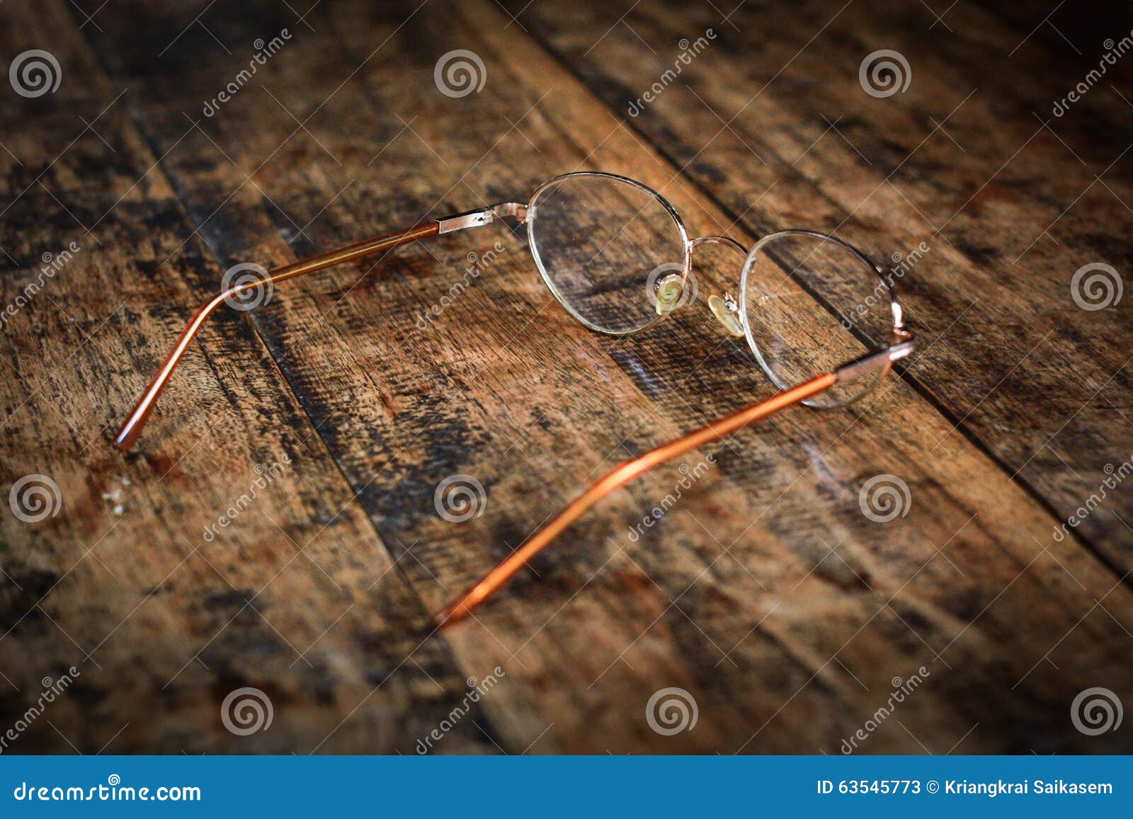 Glasses on a wooden table stock image. Image of eyeglasses - 63545773