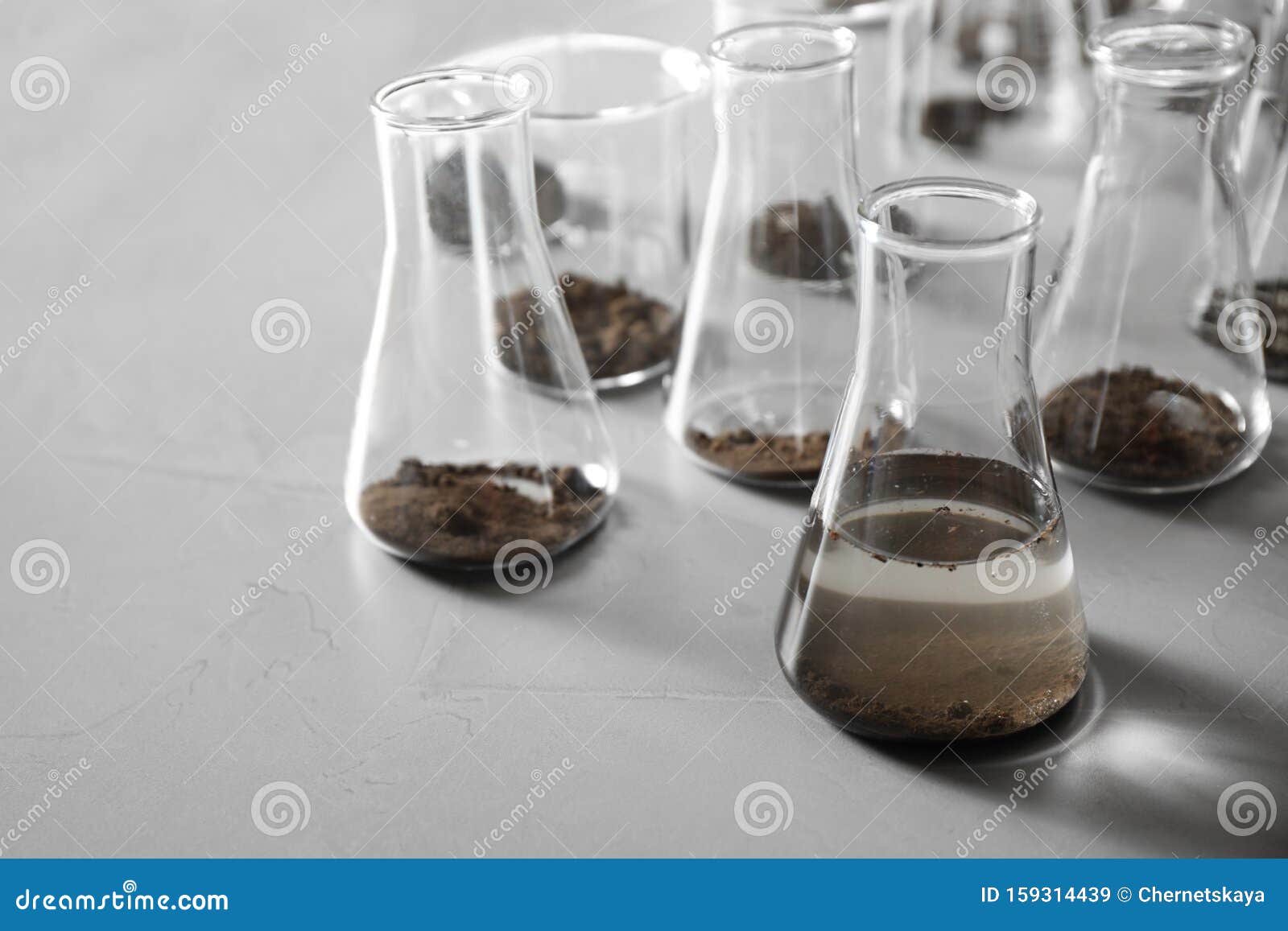 Glassware with Soil Samples and Extract on Table. Laboratory Research ...