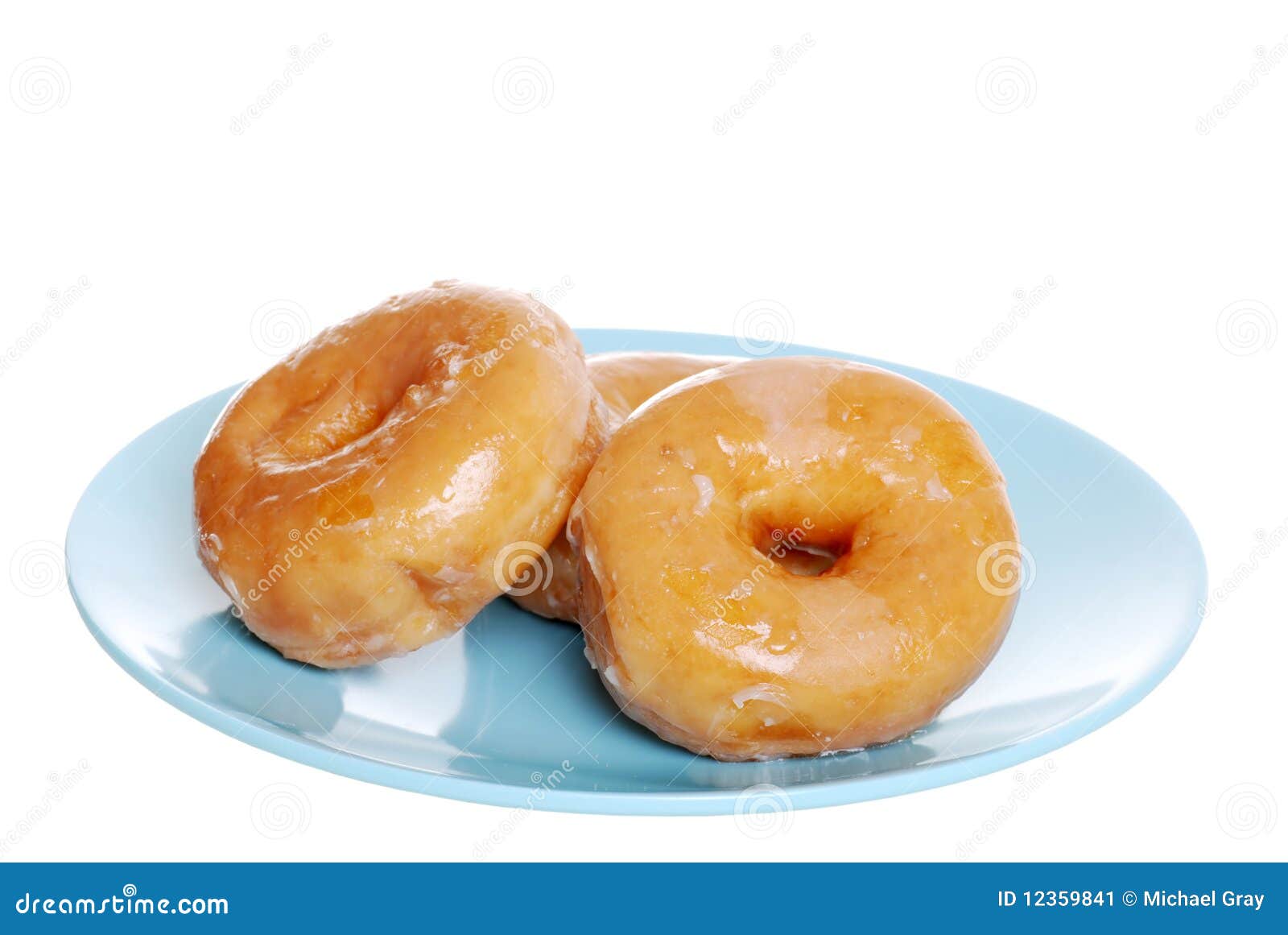 Glazed Donuts on Blue Plate Stock Image - Image of food, dessert: 12359841