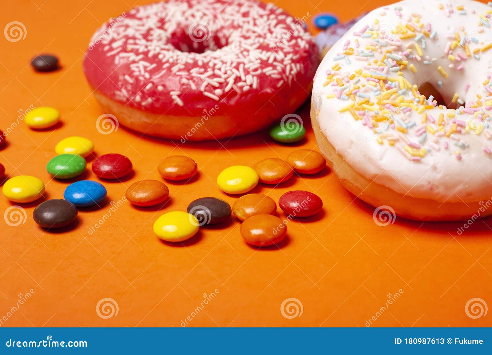 Glazed Red and White Round Bun Donuts and Multi-colored Sweets on ...