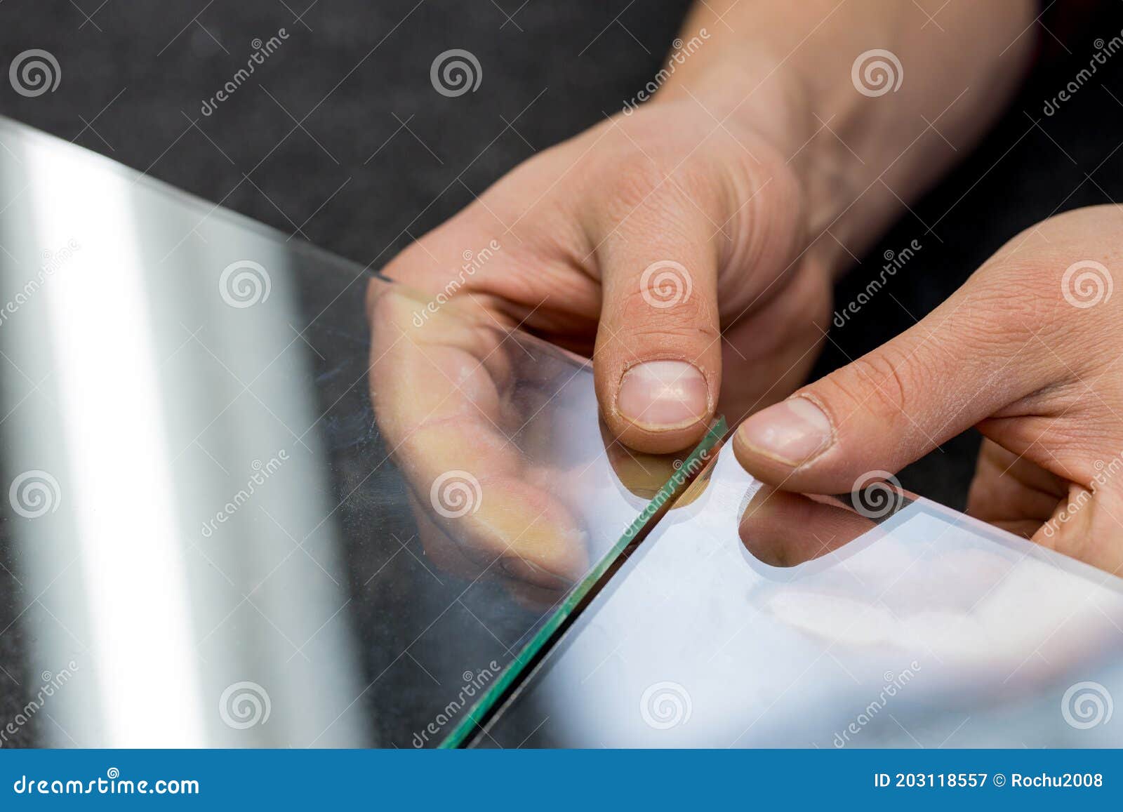 The Glazier Breaks the Glass in His Fingers Stock Image - Image of ...