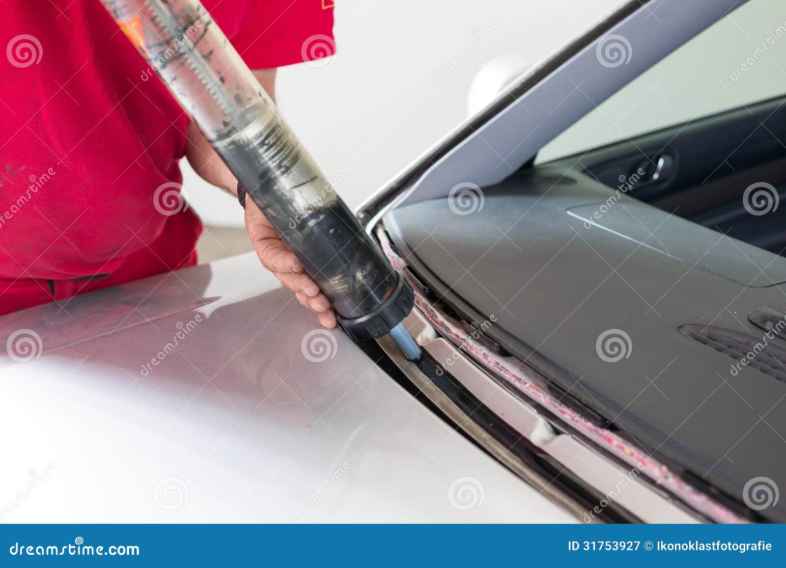 Glazier Using Application Gun To Apply Adhesive For Windscreen Stock ... Glazier Using Application Gun To Apply Adhesive For Windscreen Stock ...