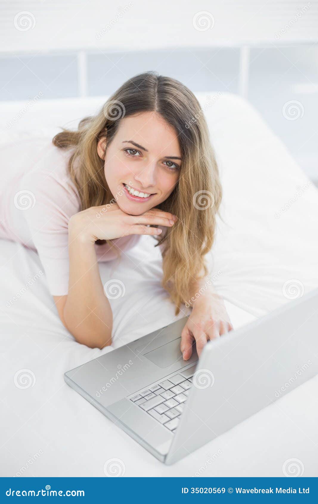 Gleeful Woman Using Her Notebook Smiling Cheerfully at Camera Stock ...