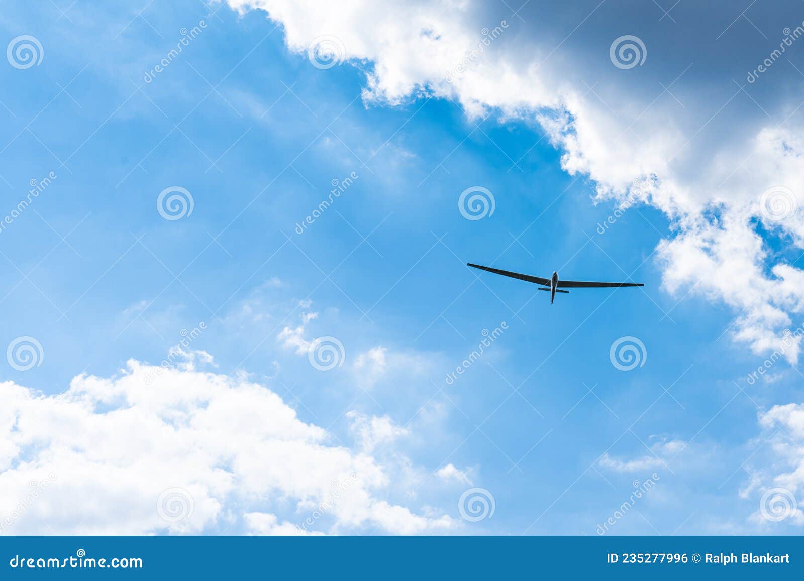 Glider Flies Elegantly through the Dramatic Clouds. Stock Photo - Image ...
