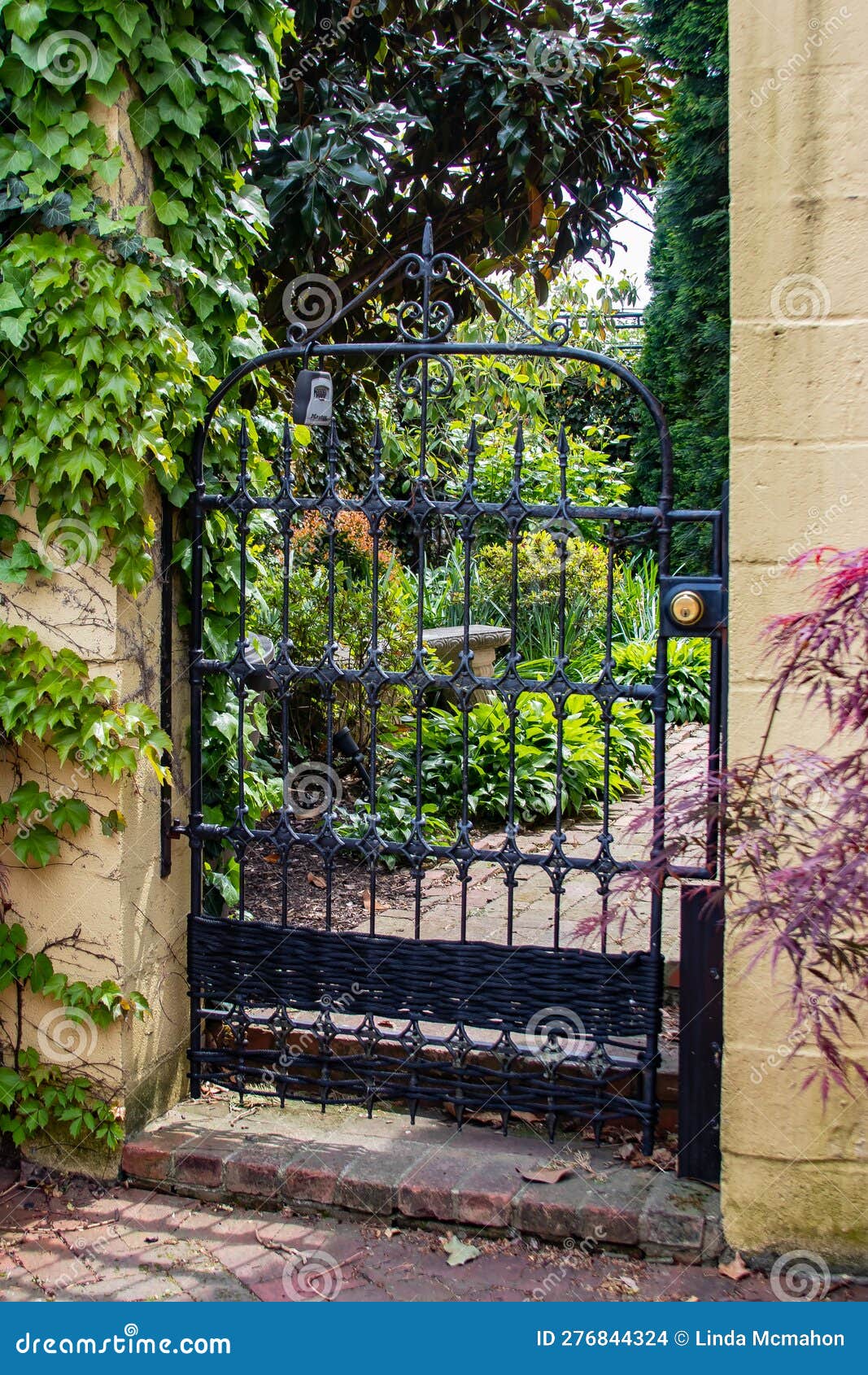 A Glimpse through the Gate of a Spring Time Garden. Stock Photo - Image ...