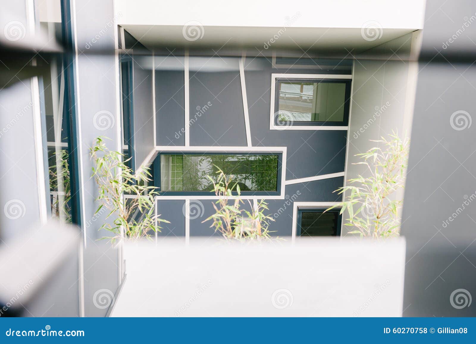 Glipse of a Modern Building with Geometric Windows Stock Photo - Image ...