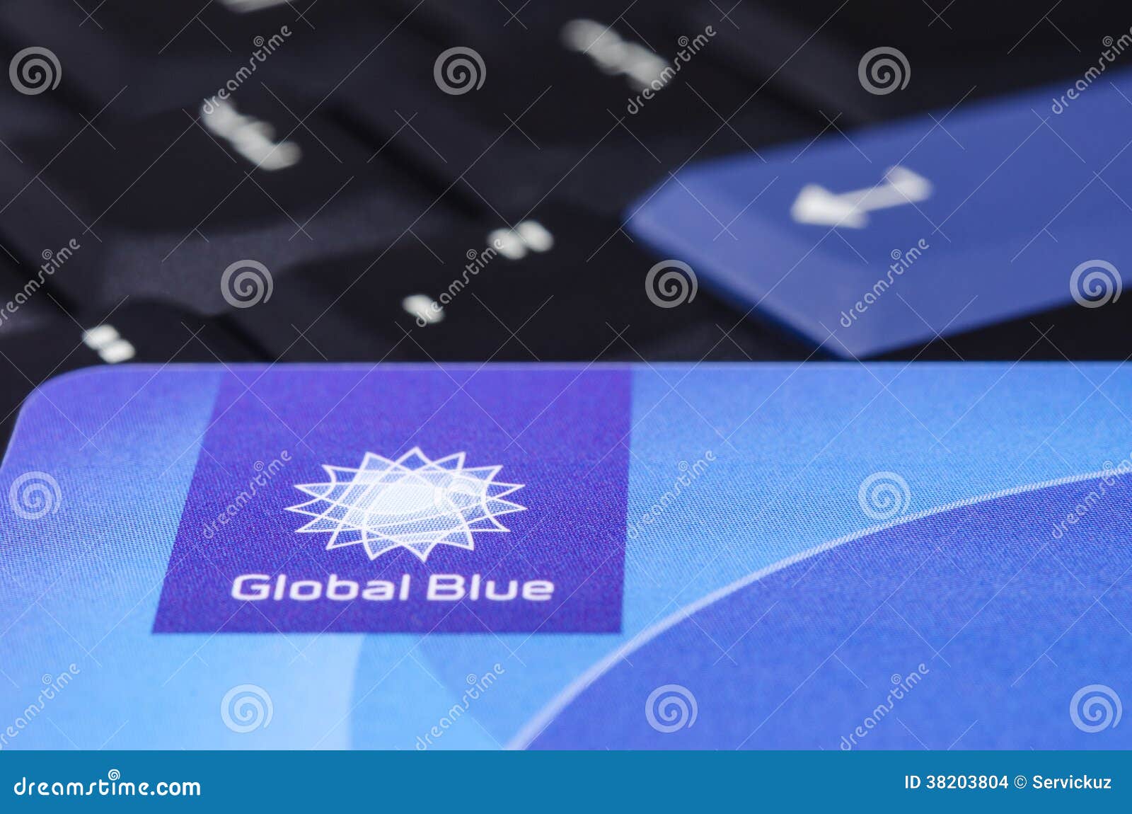 Global Blue Closeup Logo on Plastic Card Against Black ThinkPad ...