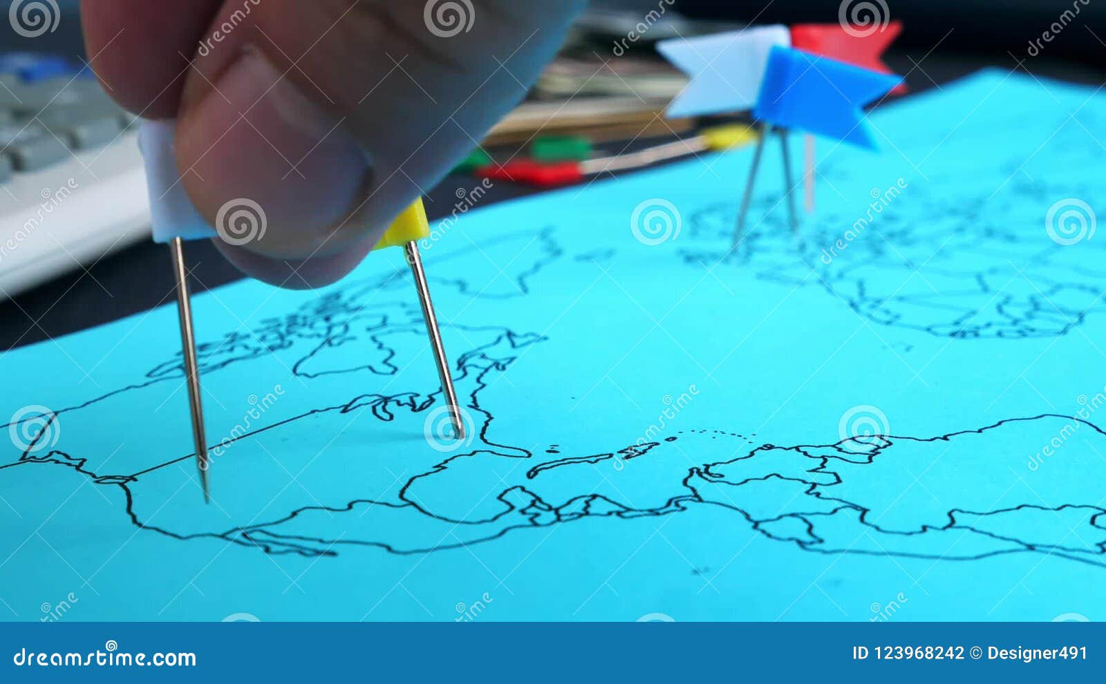 Global Business and Finances. Hand Inserts Flag in the World Map As a ...
