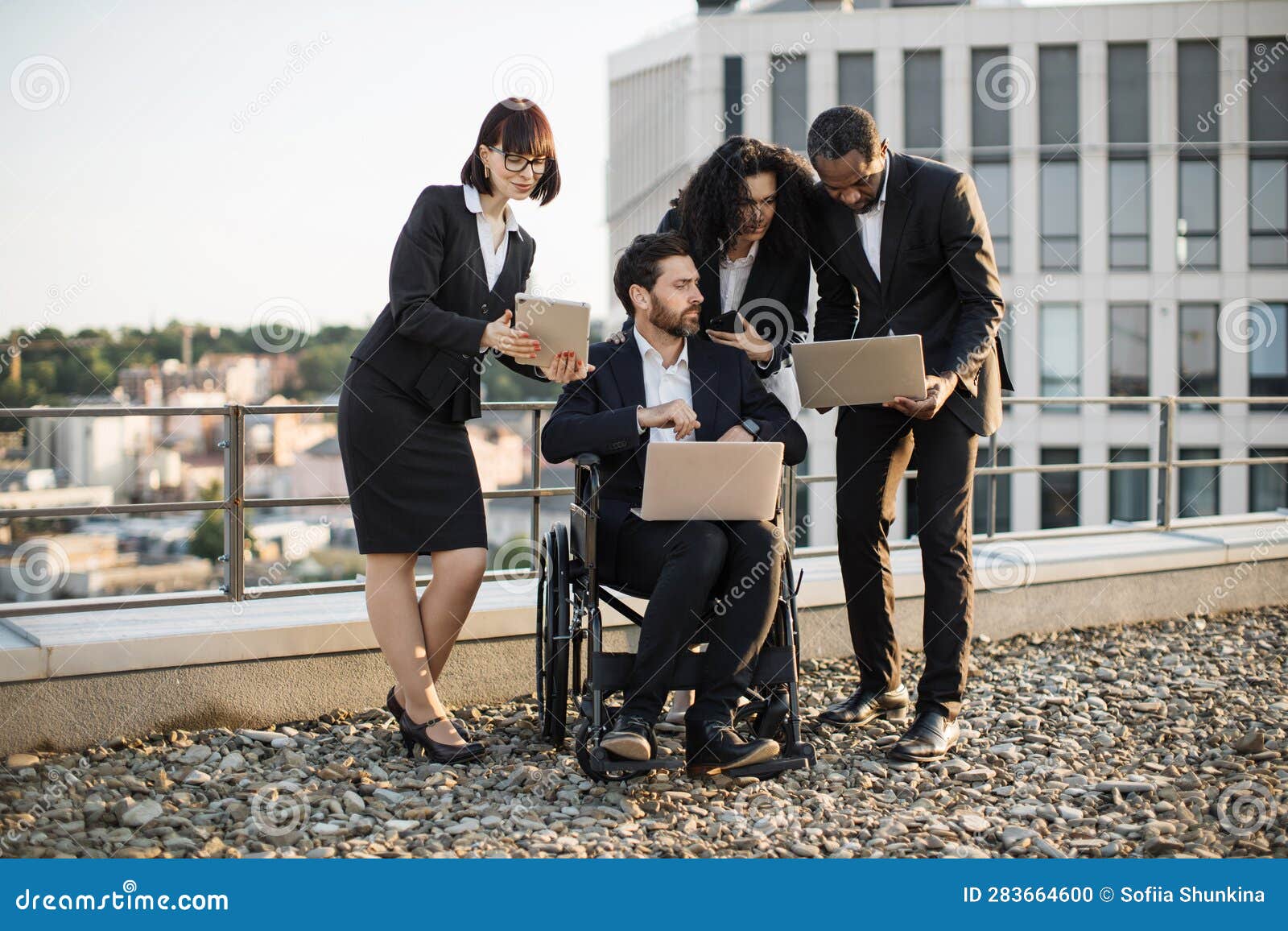 Global Experts with Gadgets Talking about Construction Plan Stock Photo ...