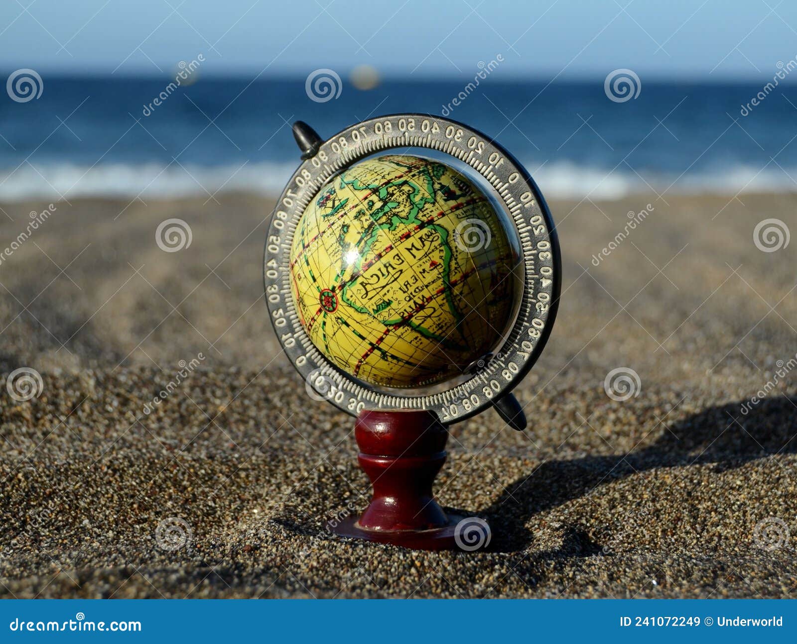 Globe Earth on the Beach stock image. Image of ball - 241072249