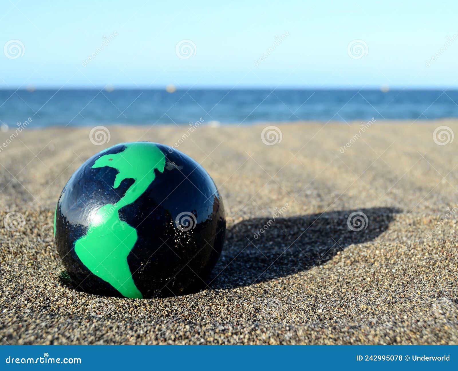 Globe Earth on the Beach stock photo. Image of global - 242995078
