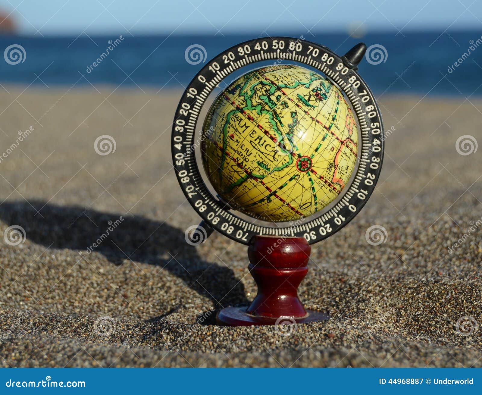 Globe Earth on the Beach stock image. Image of ecology - 44968887